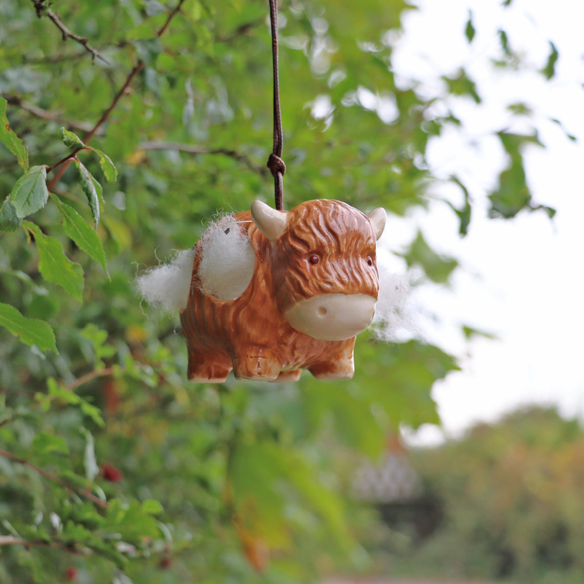 Hanging Ceramic Highland Cow With Nesting Wool | The Wildlife Community